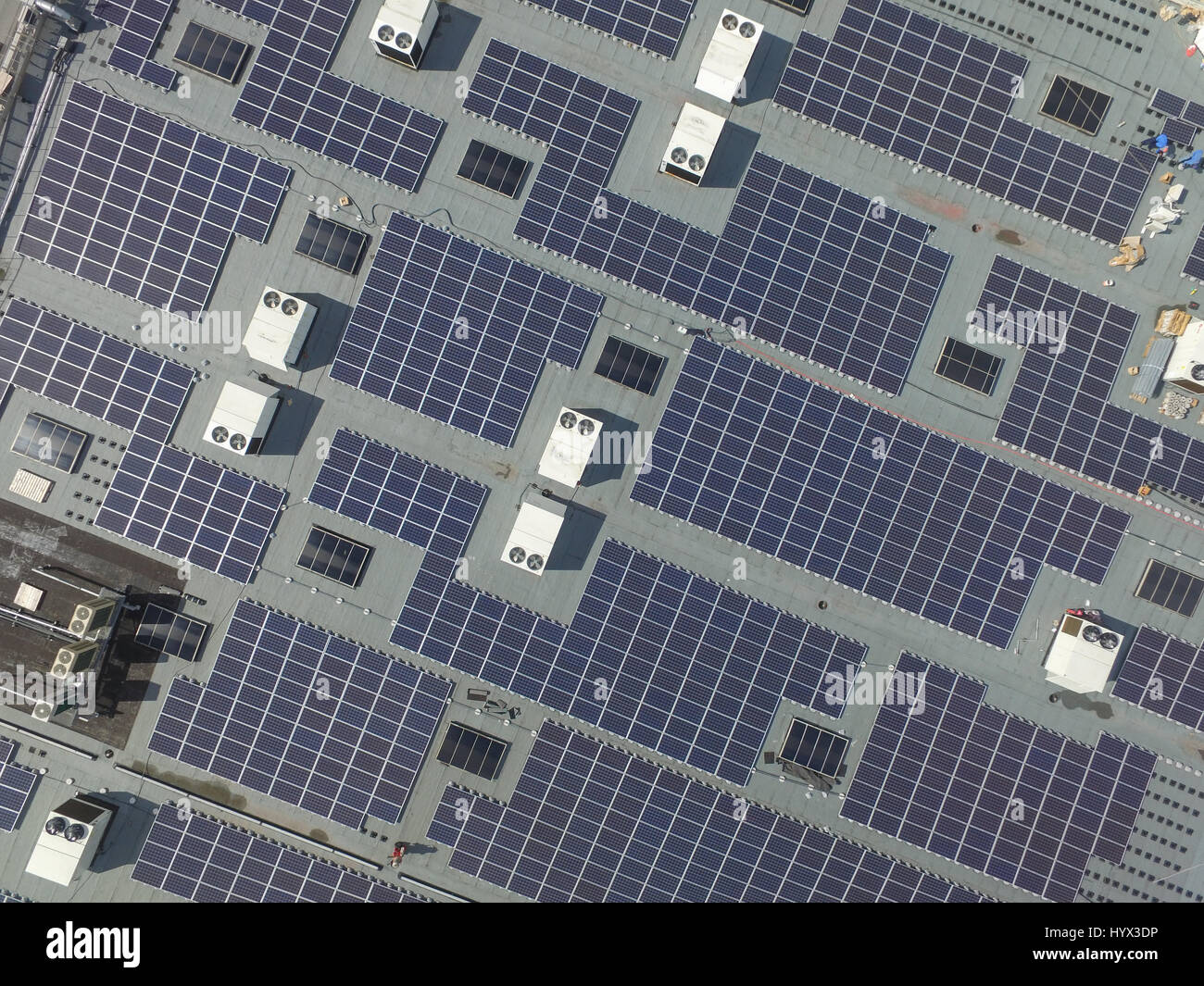 Solar panels on a flat roof Stock Photo - Alamy