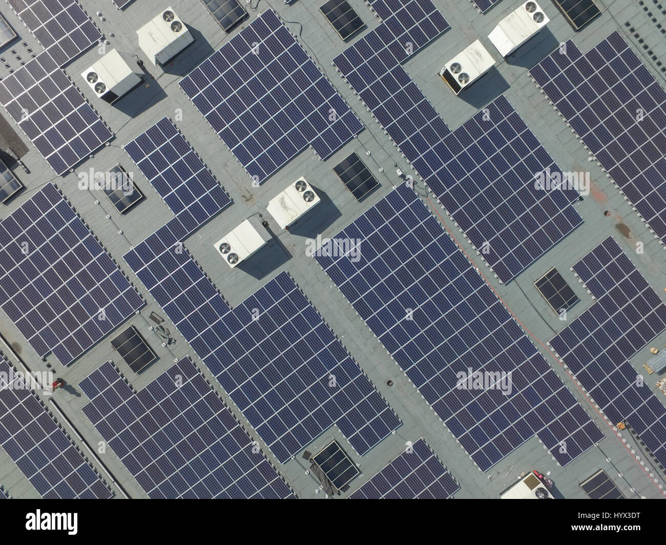 Solar panels on a flat roof Stock Photo - Alamy