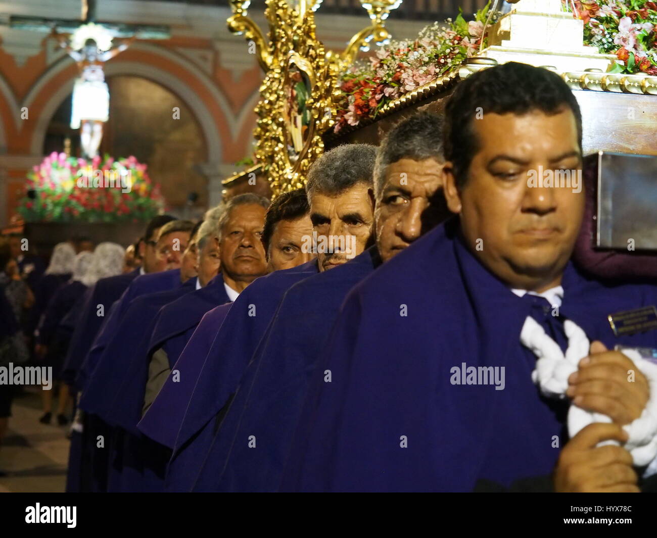 Lima, Peru. 7th April, 2017. Penitents carrying a religious litter with ...