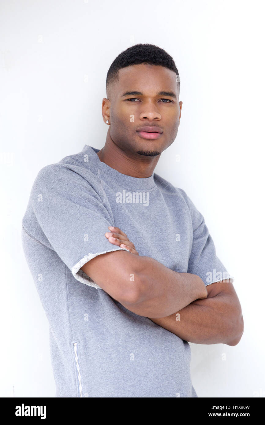 Close up portrait of an african american male fashion model with arms ...