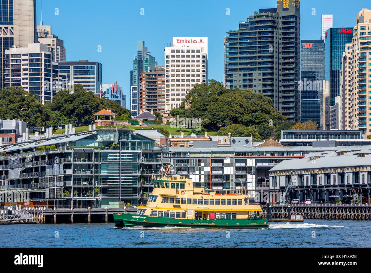 Sydney ferry on the harbour with Sydney city centre and office ...