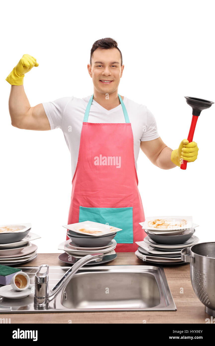 Young guy behind a sink flexing his bicep and holding a plunger ...