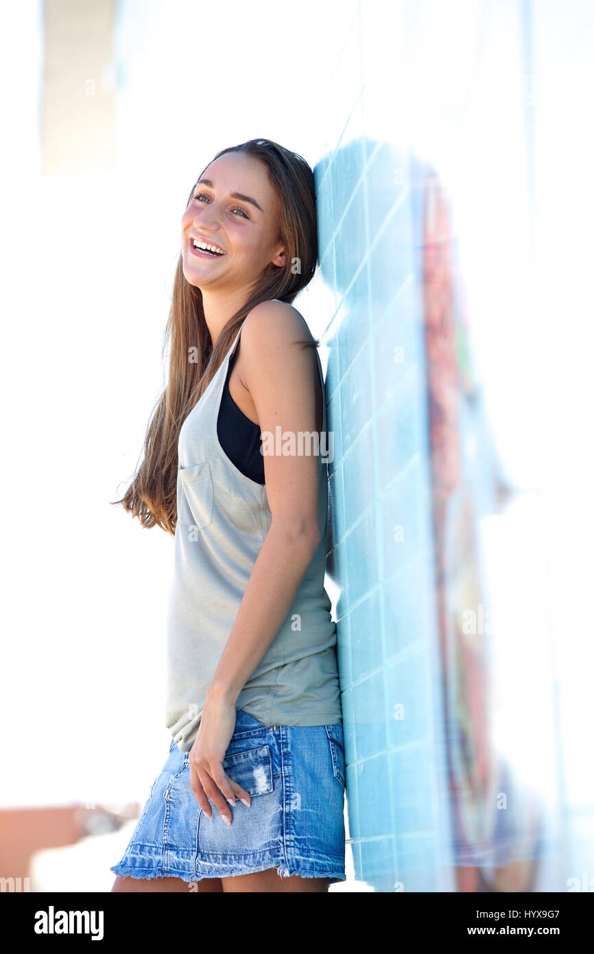Profile portrait of a smiling young woman standing outside Stock Photo ...