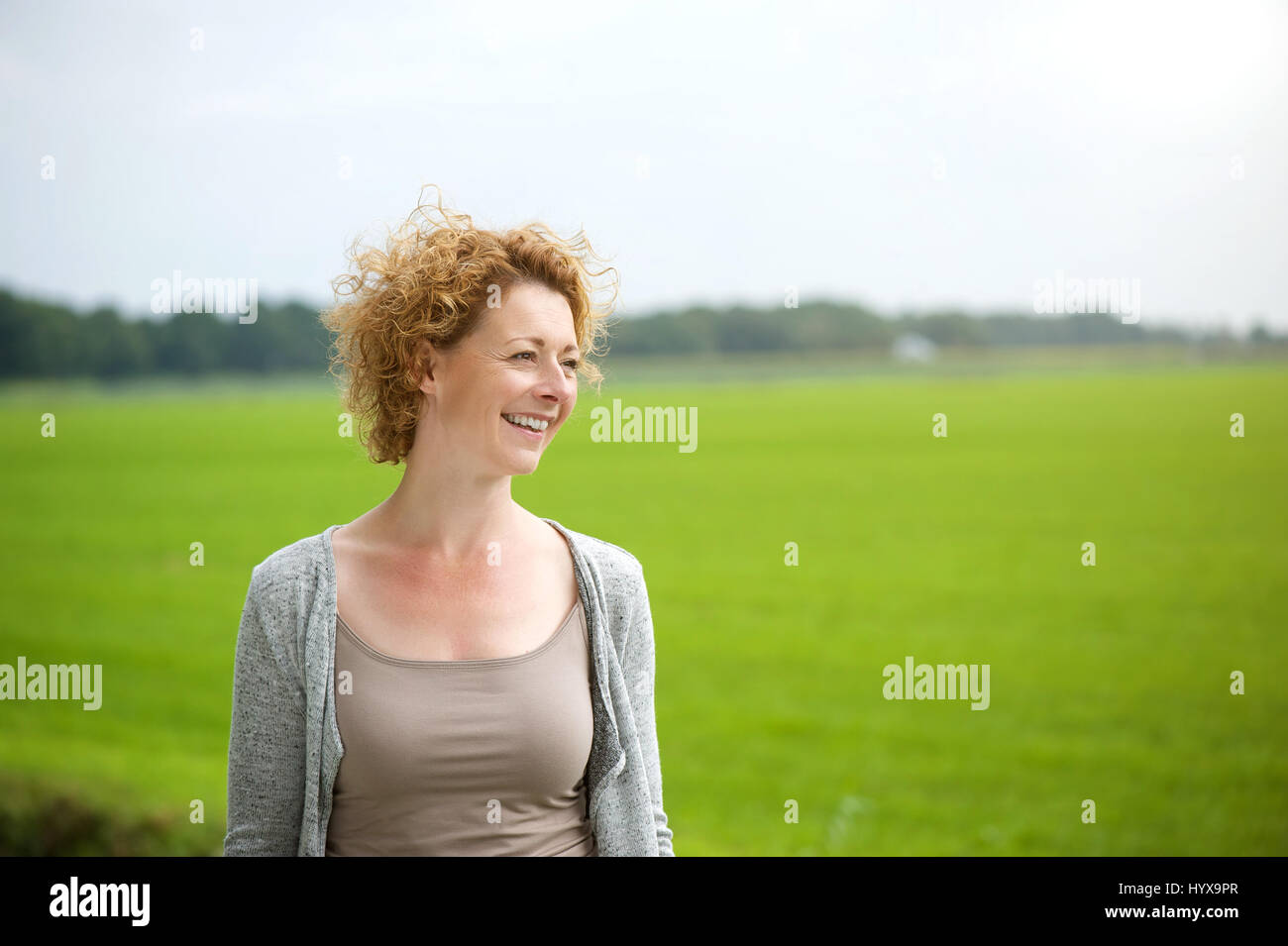 Beautiful middle aged woman laughing hi-res stock photography and images - Alamy
