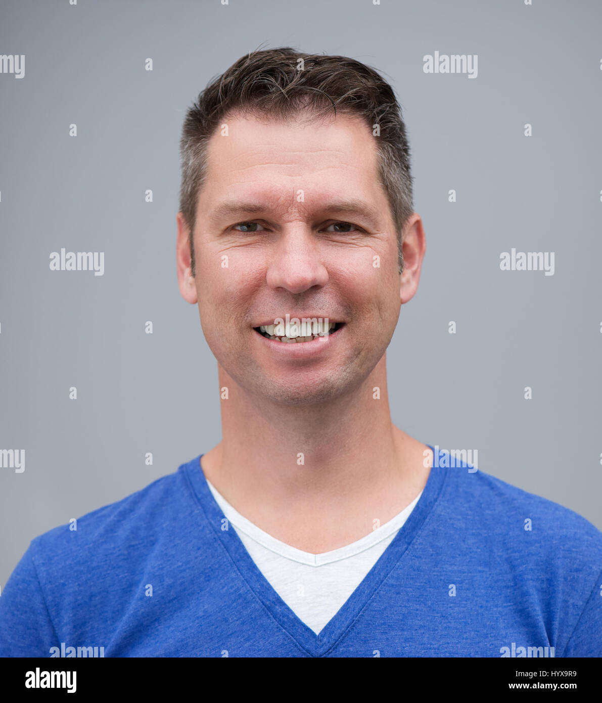 Close up portrait of a middle aged man smiling Stock Photo - Alamy