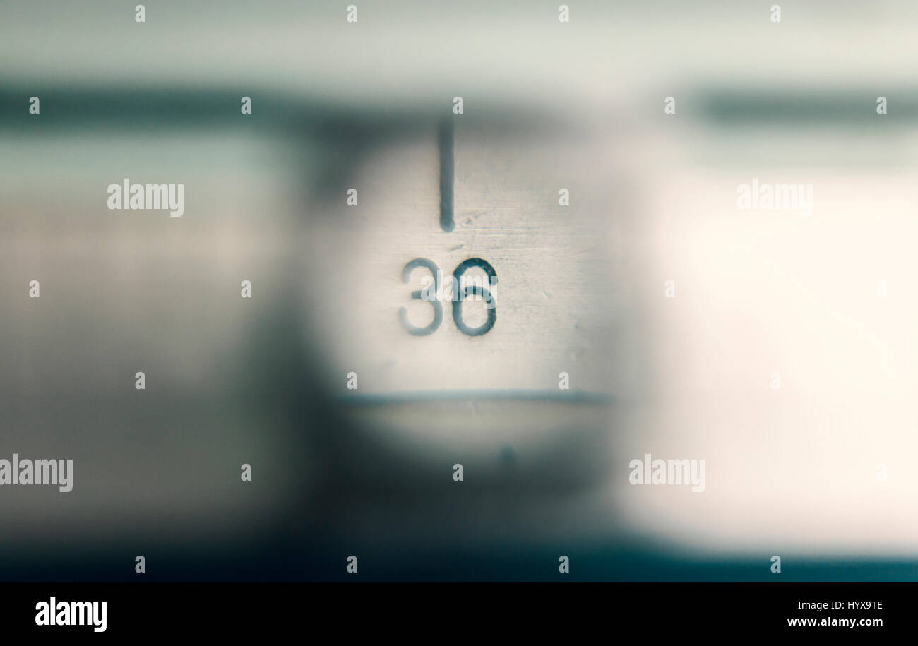 number 36 on the measuring instrument through a magnifying glass Stock ...