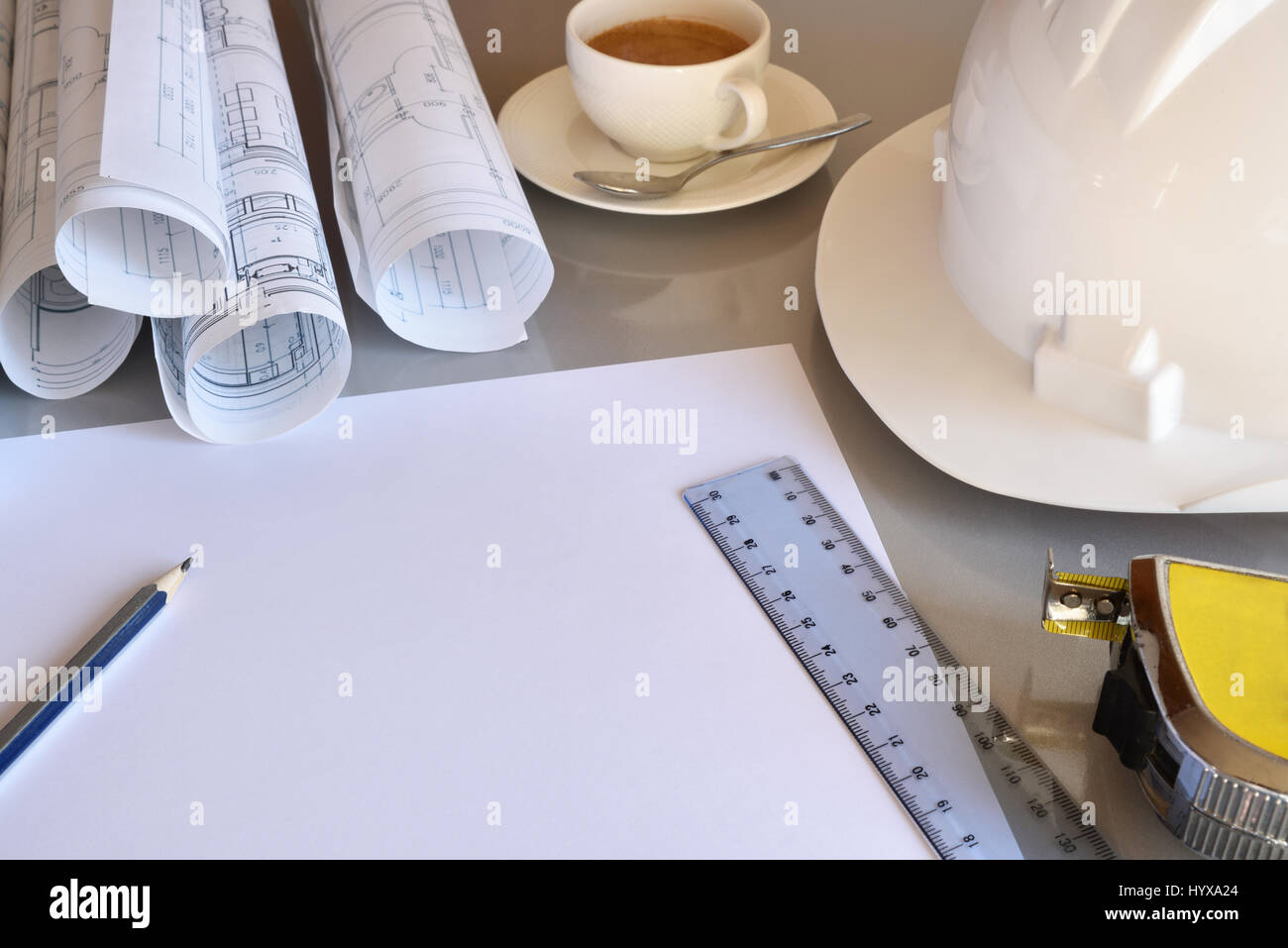Working table of a construction engineer with blank sheet for new ...