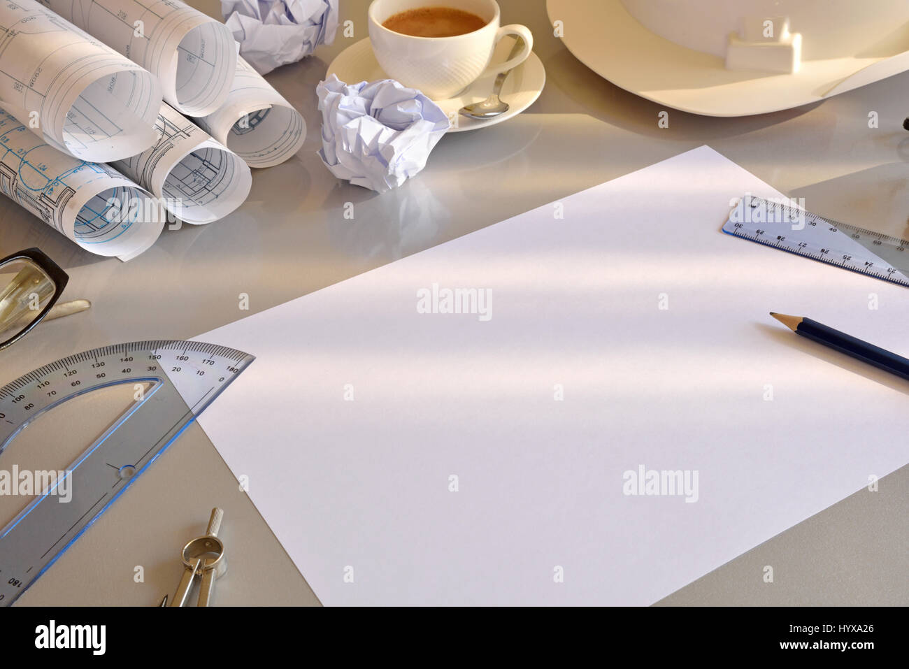 Working table of a construction engineer with blank sheet for new ...