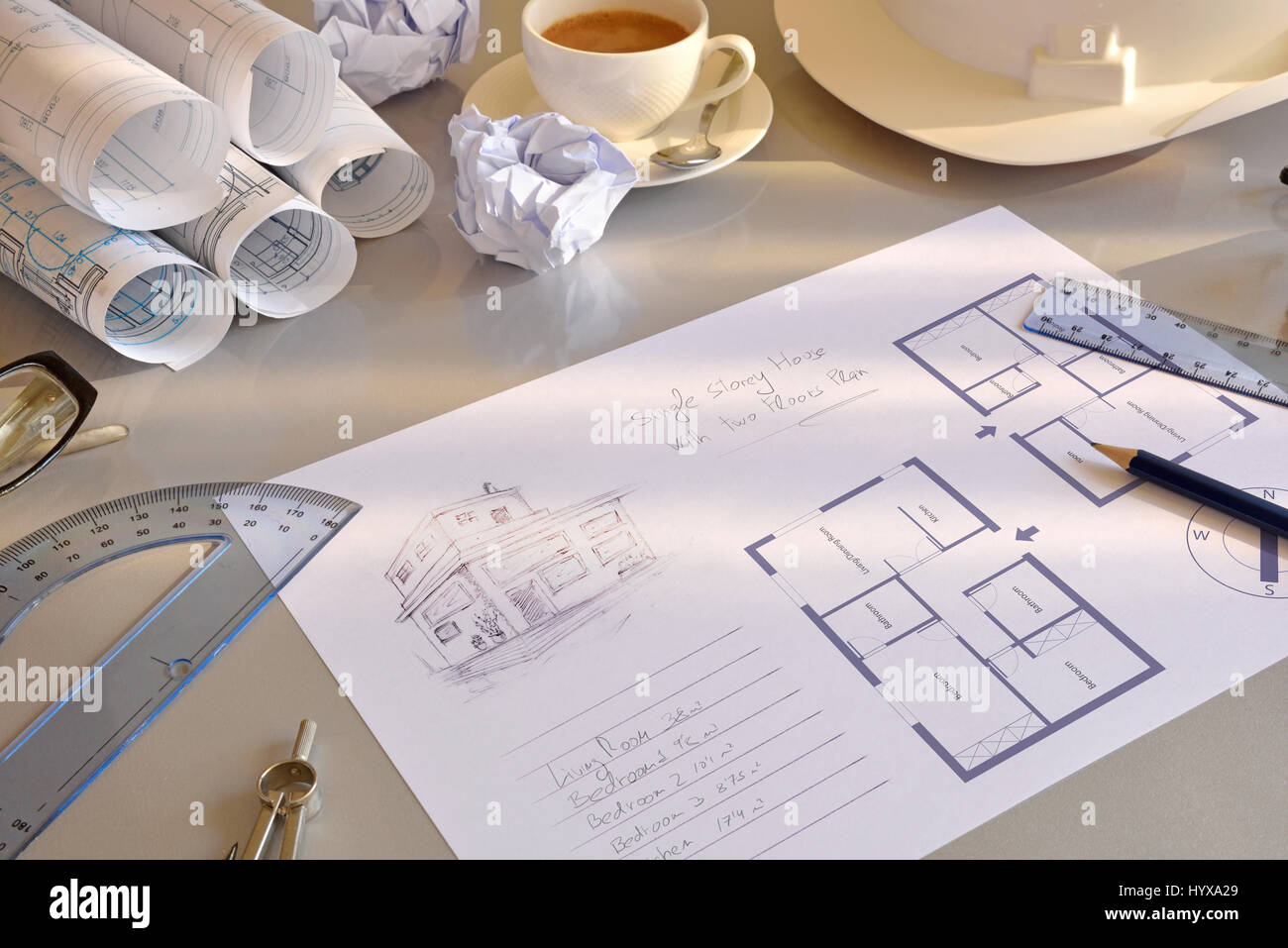 Working table of a construction engineer with plan of a project ...