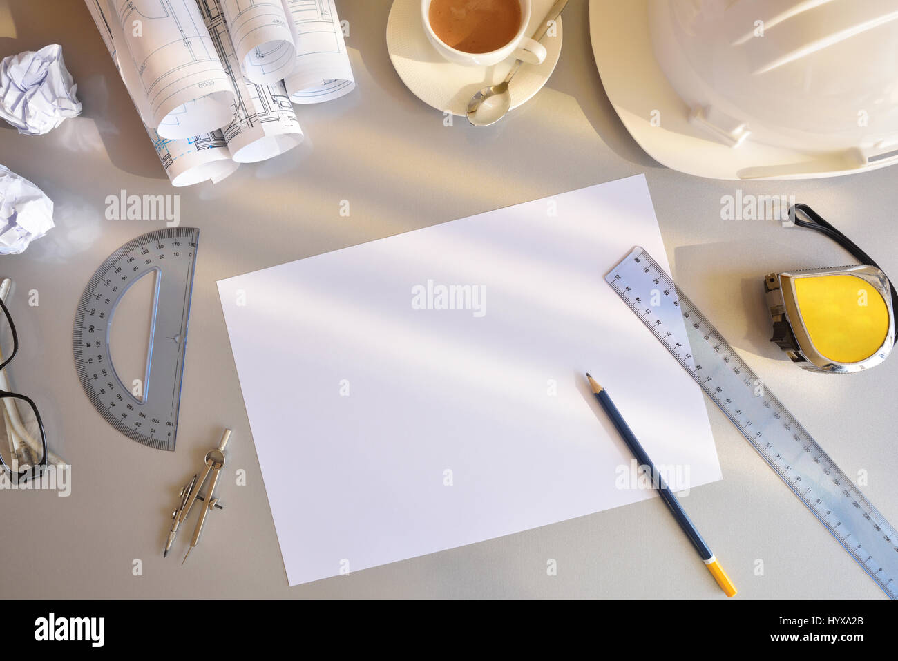 Working table of a construction engineer with blank sheet for new ...