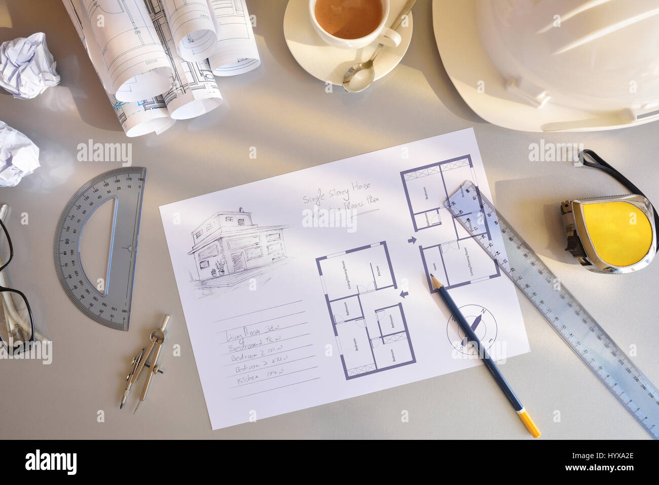 Working table of a construction engineer with plan of a project ...
