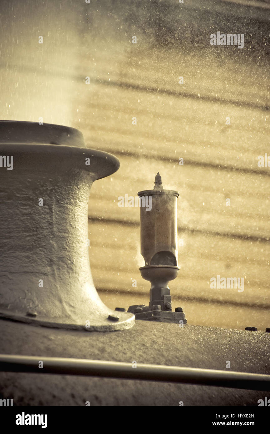 steam escaping from the funnel of a vintage railroad engine Stock Photo ...