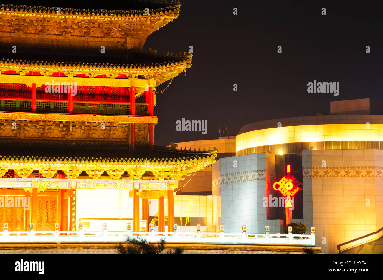 The historic bell tower lit up at night in the city of Xian China in ...
