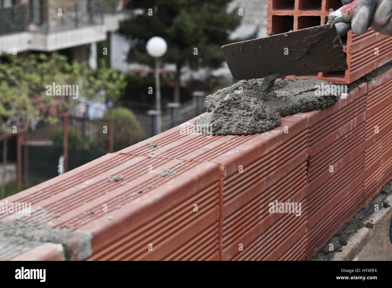 Mason builds wall building hi-res stock photography and images - Alamy