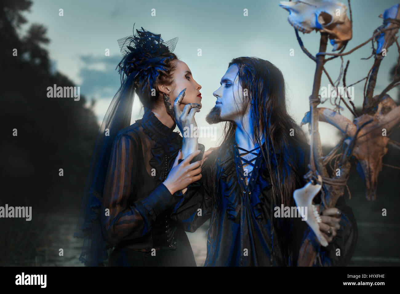 Creepy people conjure night, they look like demons Stock Photo - Alamy