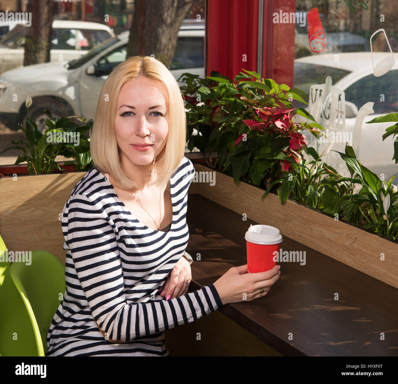 beautiful girl in the coffee shop around the computer Stock Photo - Alamy