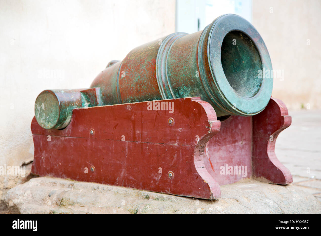 in africa morocco green bronze cannon and the blue sky Stock Photo - Alamy