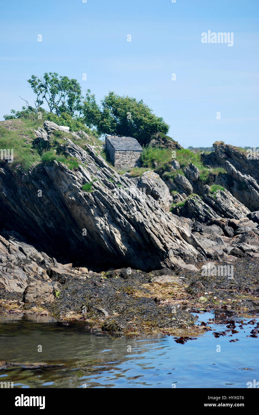 Small stone hut on a rocky cliff overlooking the sea Stock Photo - Alamy