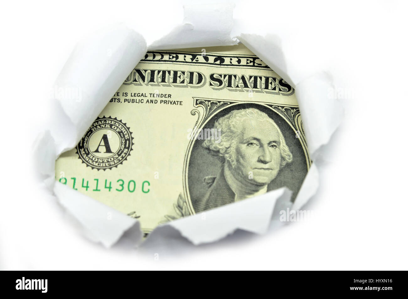 US currency macro peeking through torn white paper Stock Photo - Alamy