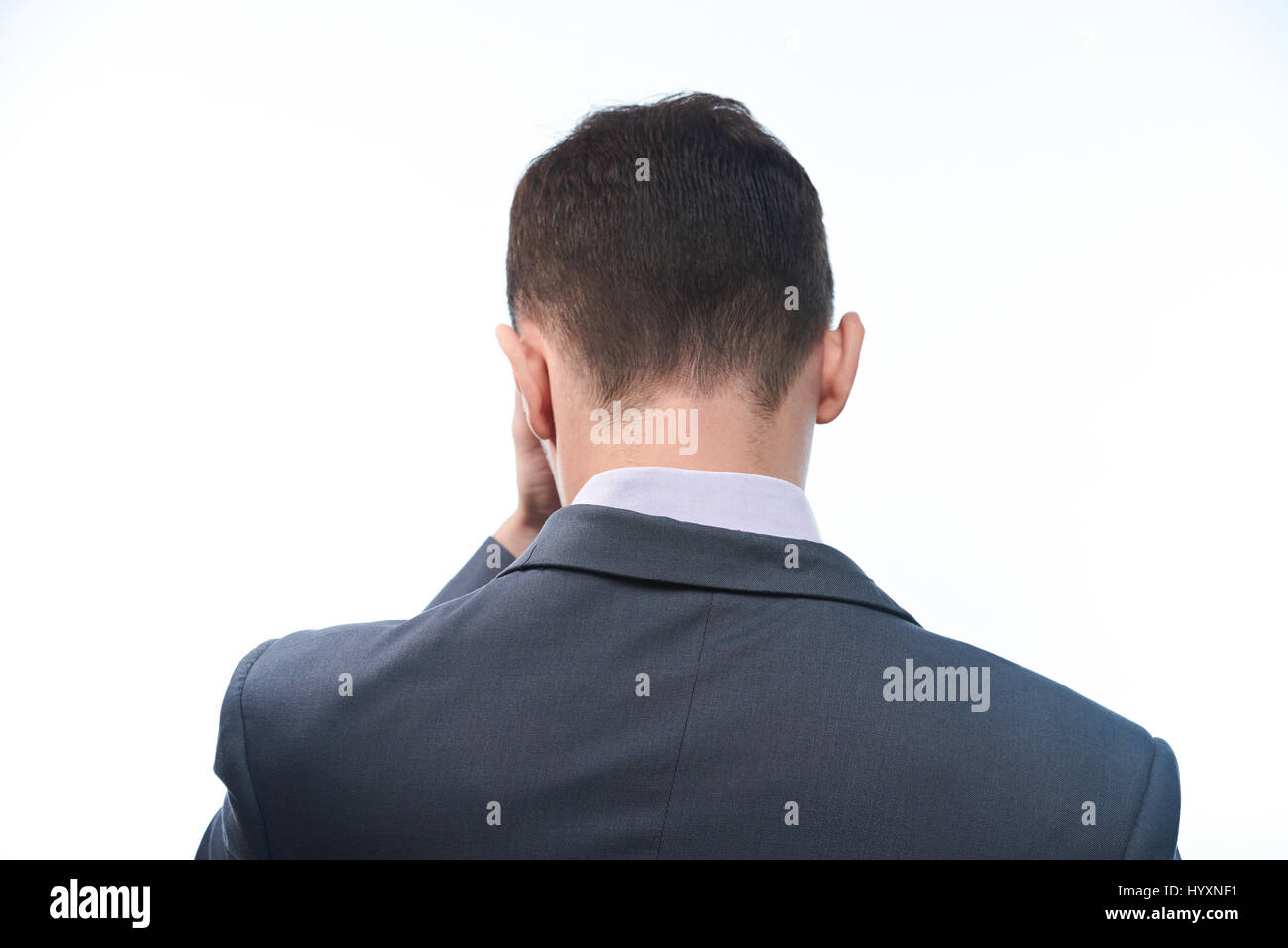 Tired business man view from back close-up isolated on white background ...