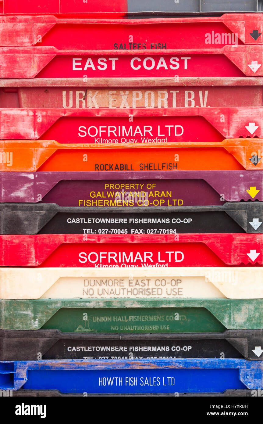 Colourful fish crates stacked up on quayside in Killybegs harbour ...