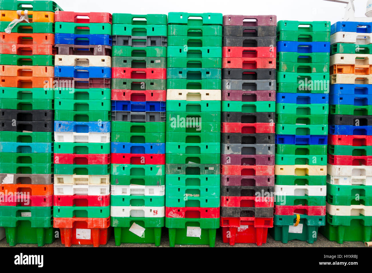 Colourful fish crates stacked up on quayside in Killybegs harbour ...