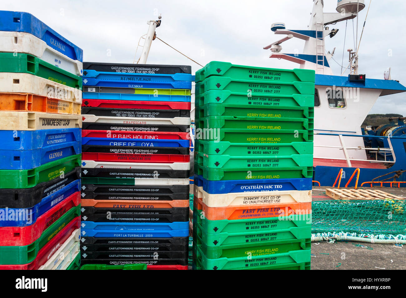 Colourful fish crates stacked up on quayside in Killybegs harbour ...