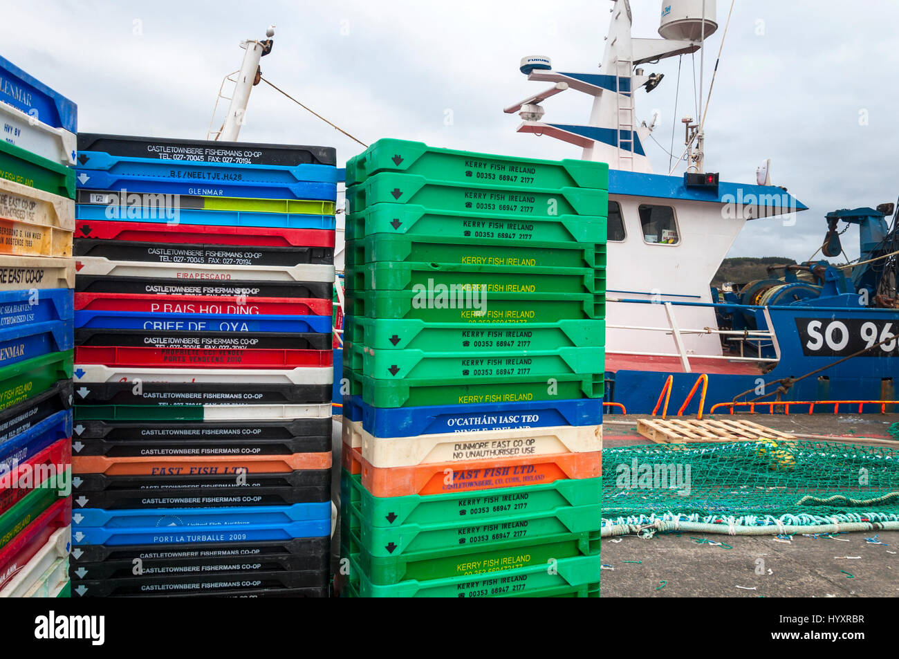 Colourful fish crates stacked up on quayside in Killybegs harbour ...