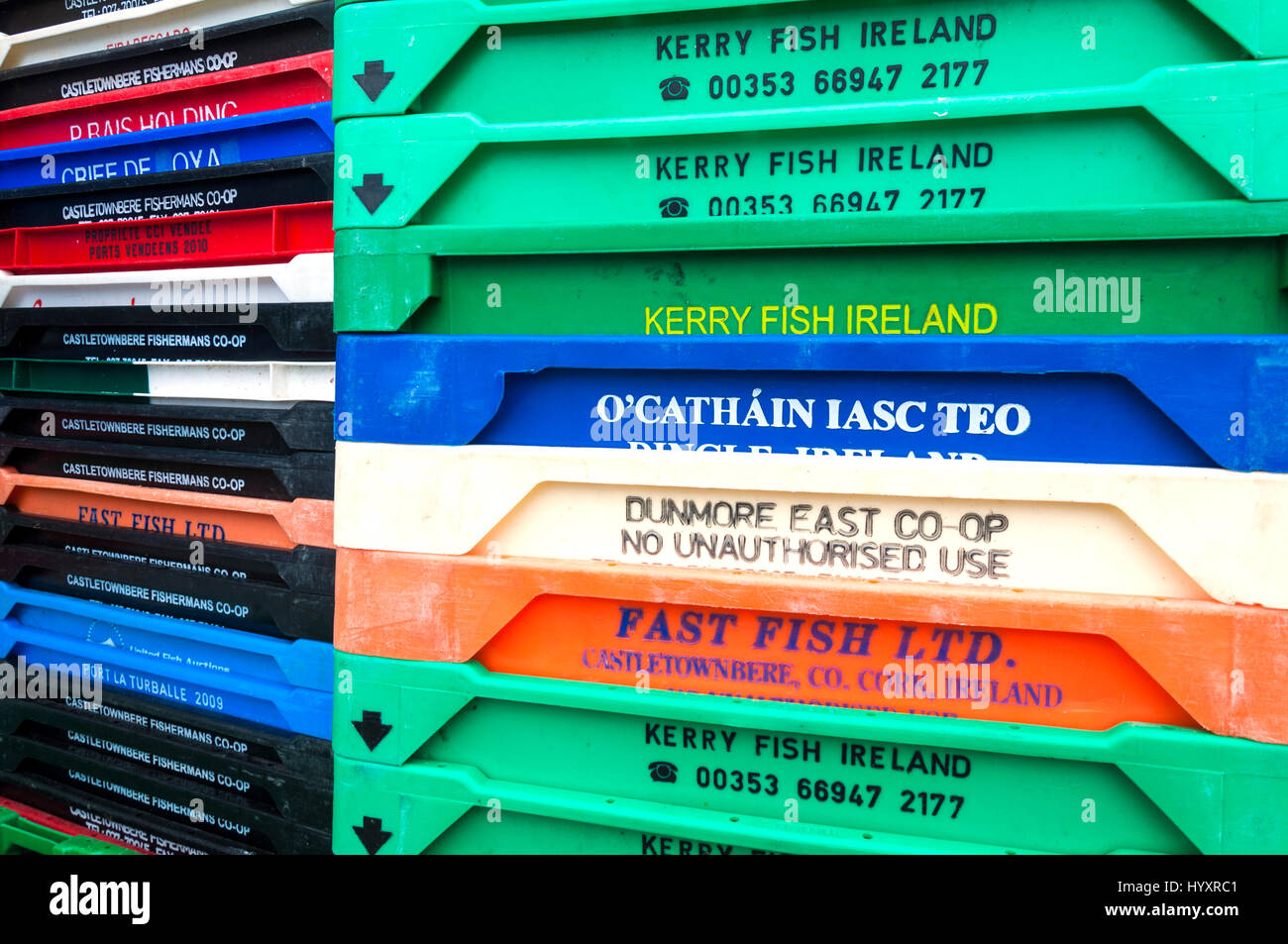 Colourful fish crates stacked up on quayside in Killybegs harbour ...