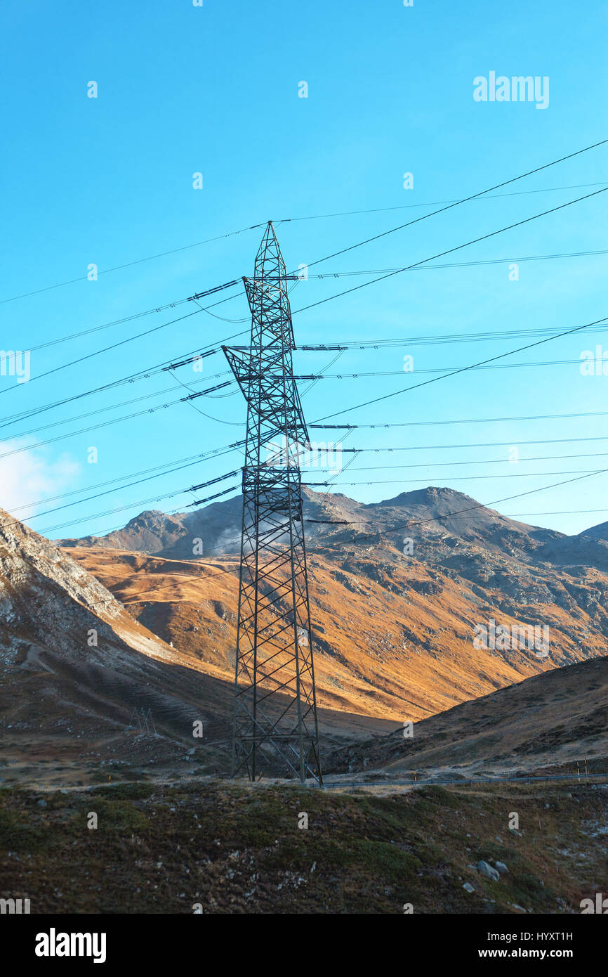 Electricity line in Alps Stock Photo - Alamy