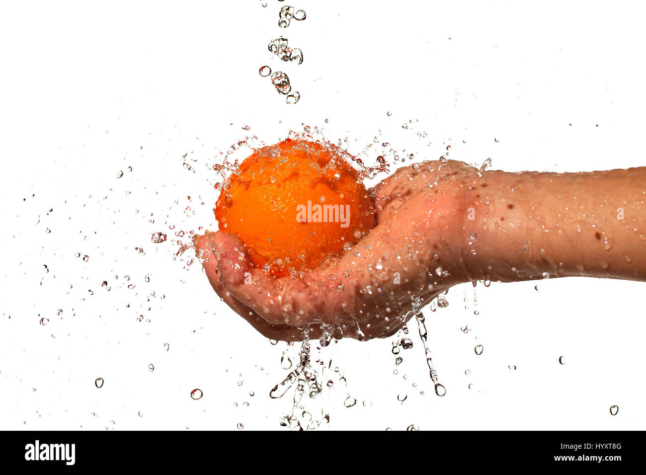 Water, orange and hand isolated on white Stock Photo - Alamy
