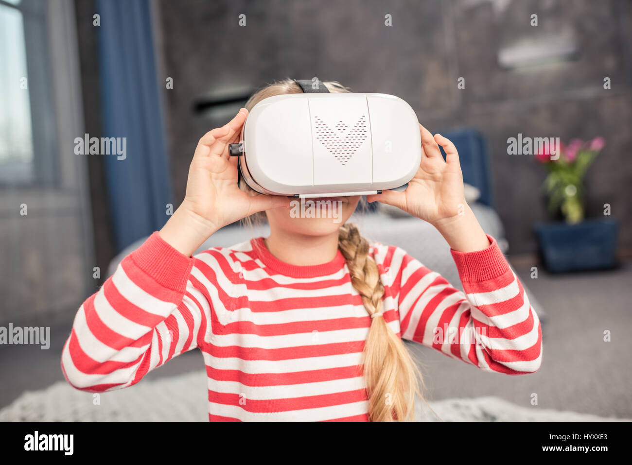 Cute girl wearing virtual reality headset and smiling Stock Photo - Alamy