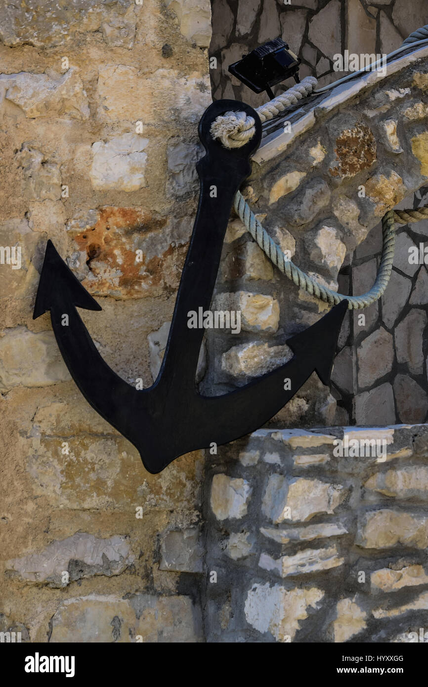 Part of a stone arch with navy anchor Stock Photo - Alamy
