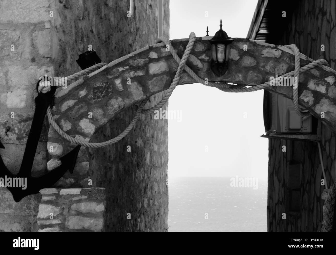 Stone arch with navy anchor Stock Photo - Alamy