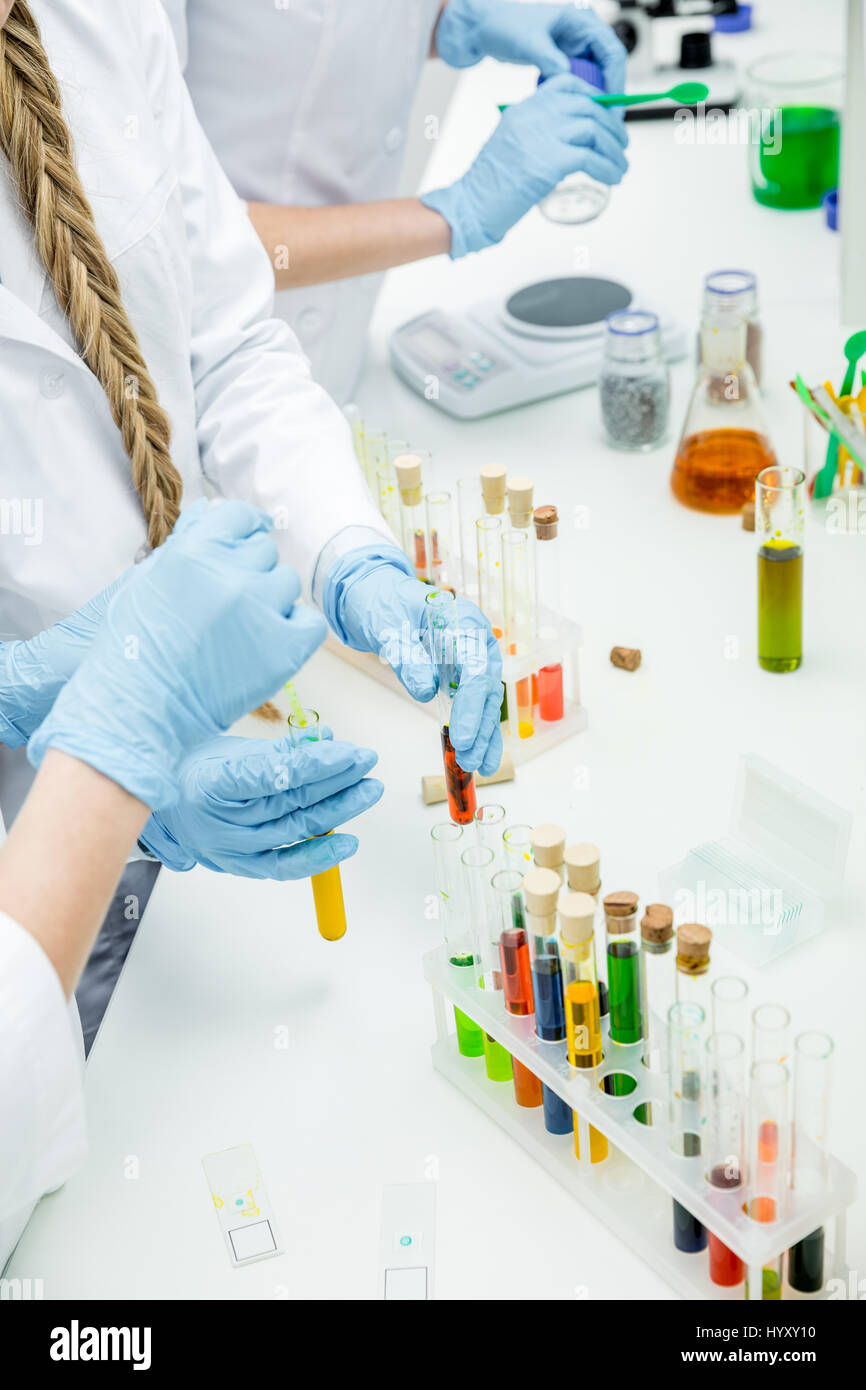 side view of scientists working in laboratory Stock Photo - Alamy
