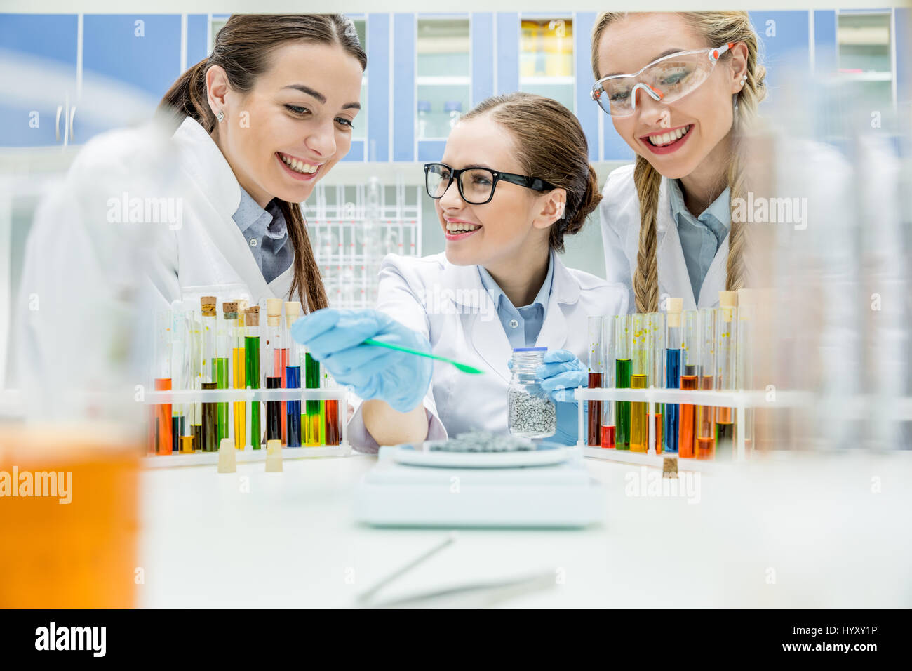 Happy female scientists making experiment in chemical laboratory Stock ...