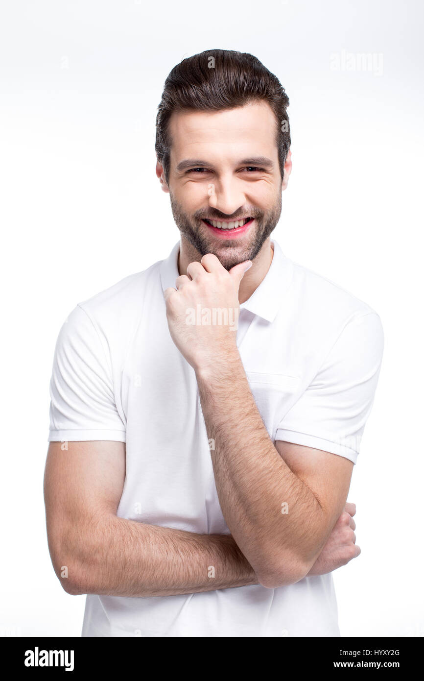 Young man with hand on chin hi-res stock photography and images - Alamy