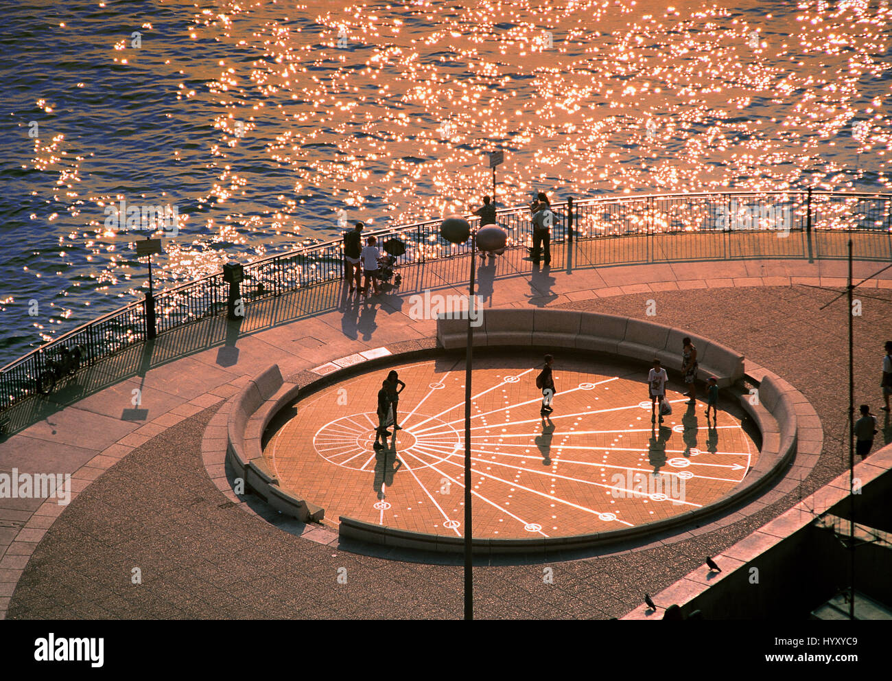 Tourists strolling at sunset on the Sundial in the Nice waterfront ...