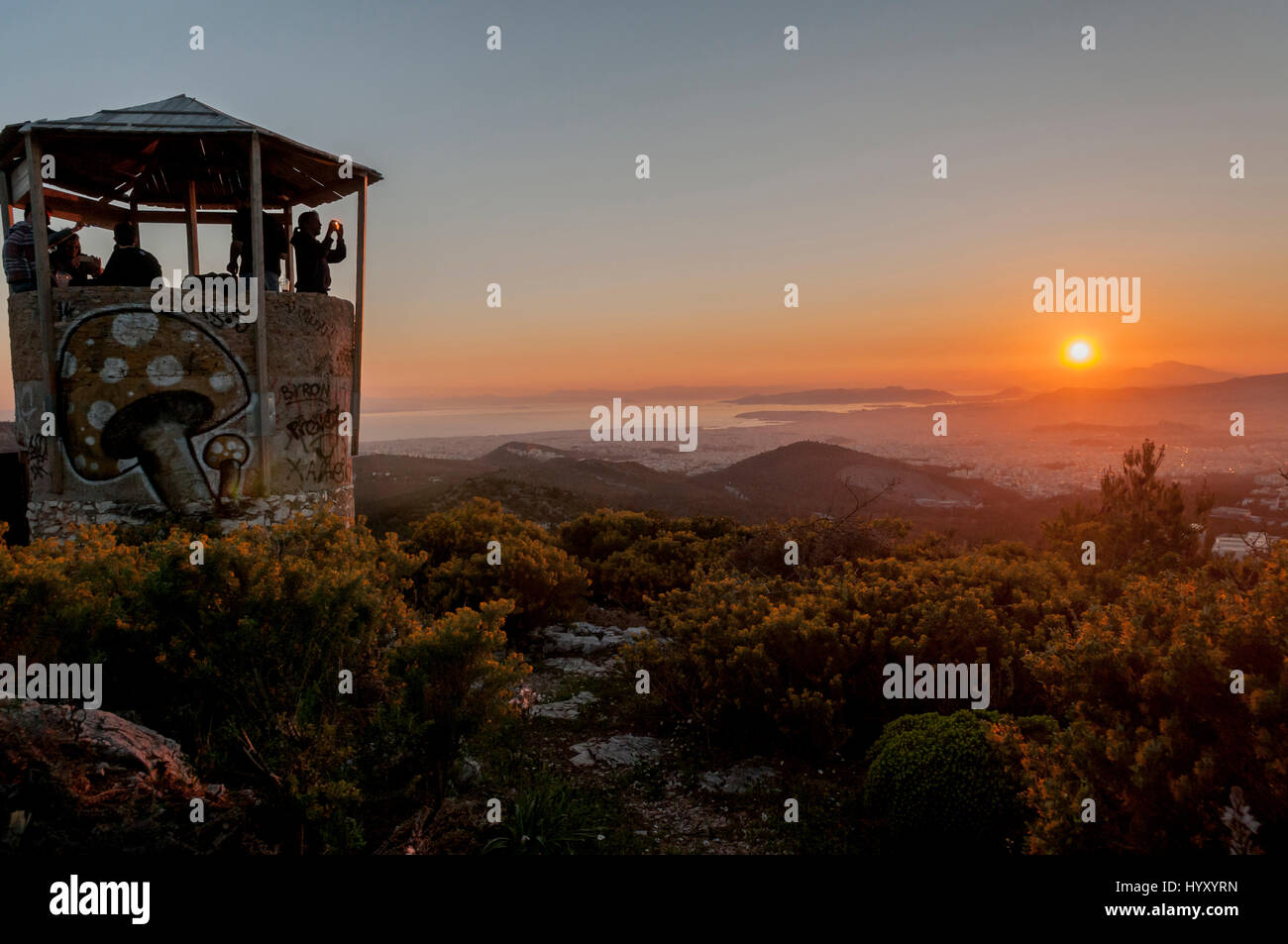 Group of young people watching the sunset Stock Photo - Alamy