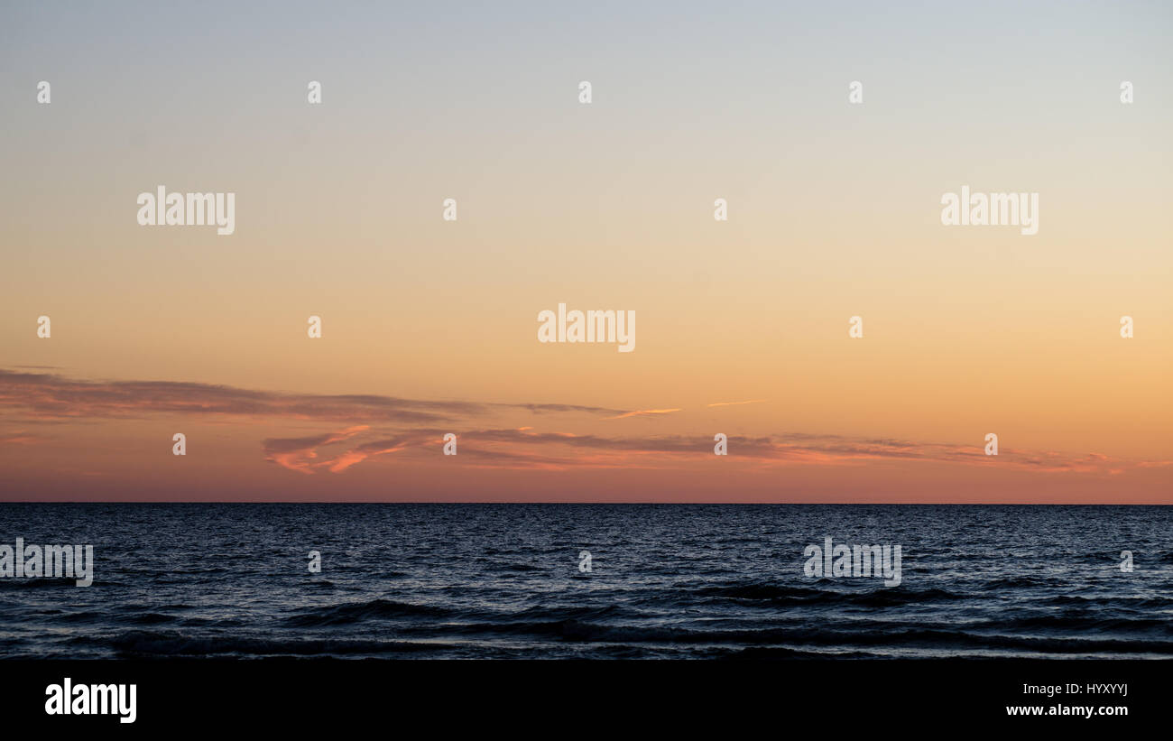 sunset over the sea beach in summer Stock Photo - Alamy