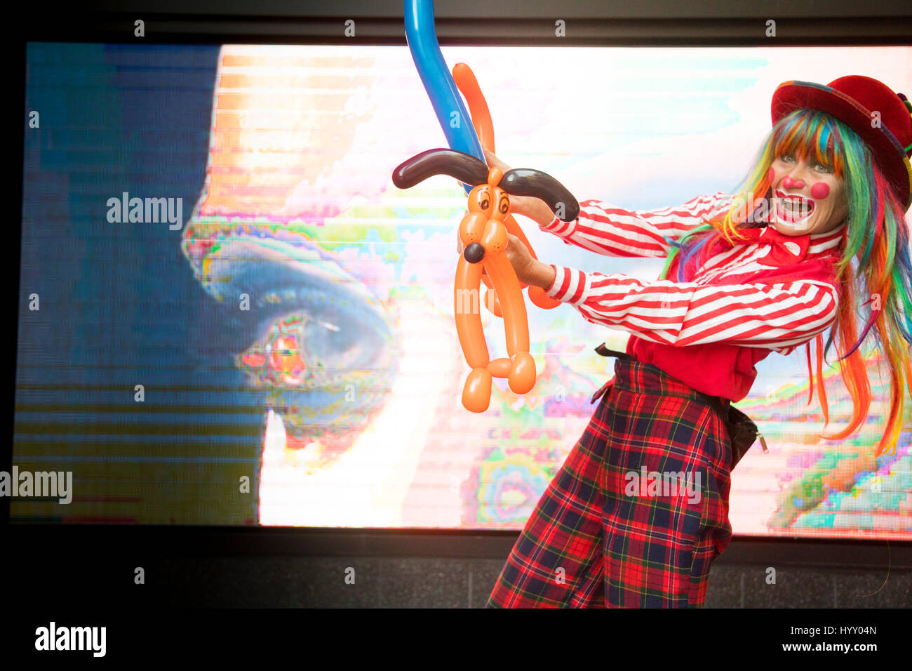 Clown in front of an electronic display, Hollywood Boulevard, Los ...