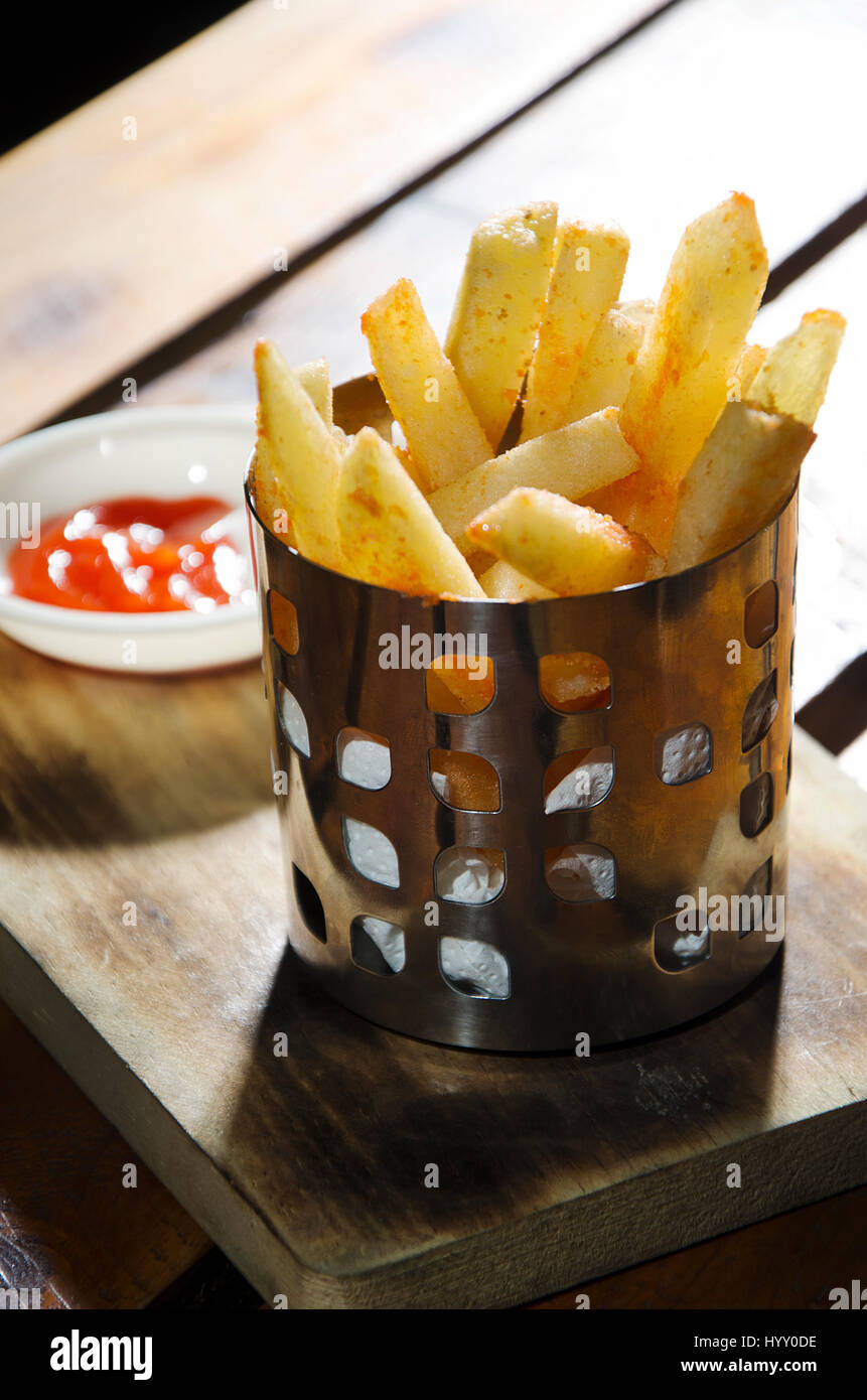 french fries with chili sauce as a background Stock Photo - Alamy