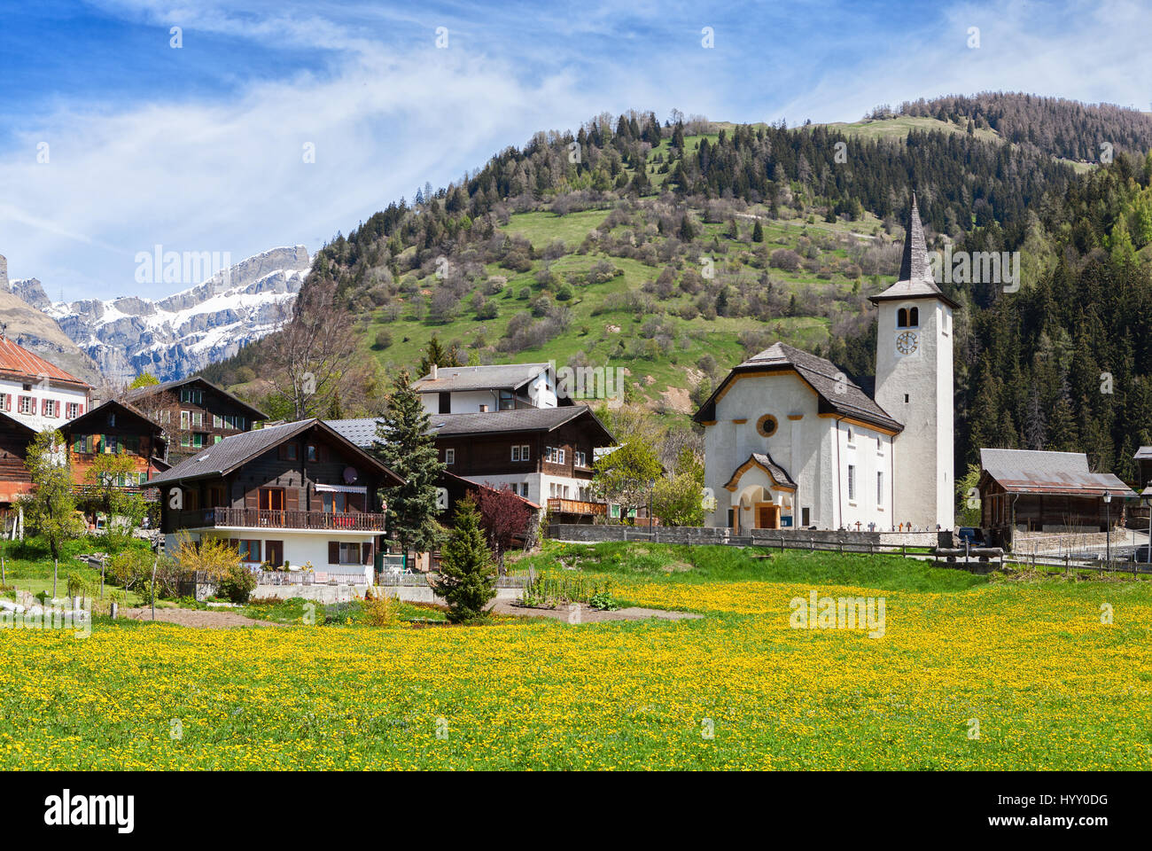 Beautiful Alpine landscape with church and typical Swiss houses at ...