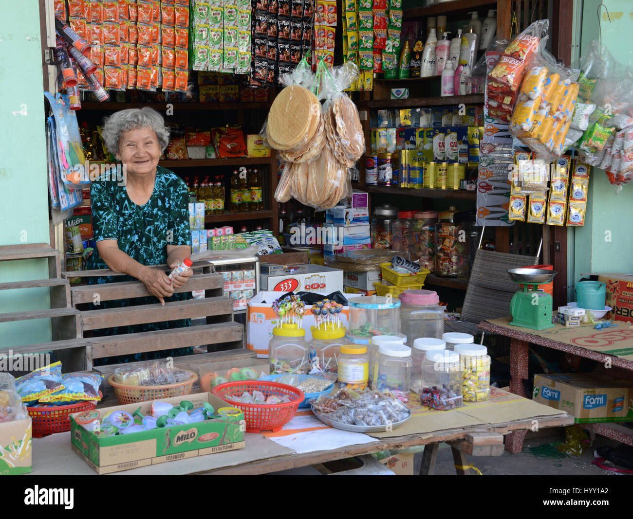 Woman shopkeeper in Cambodian village Stock Photo - Alamy