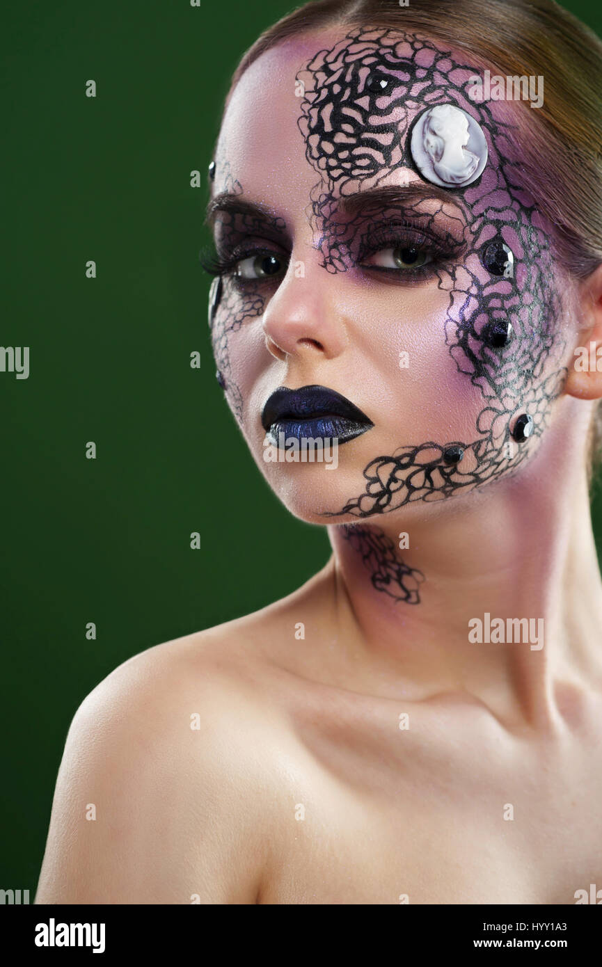 Magical look. Beautiful woman wearing professional art makeup with ...