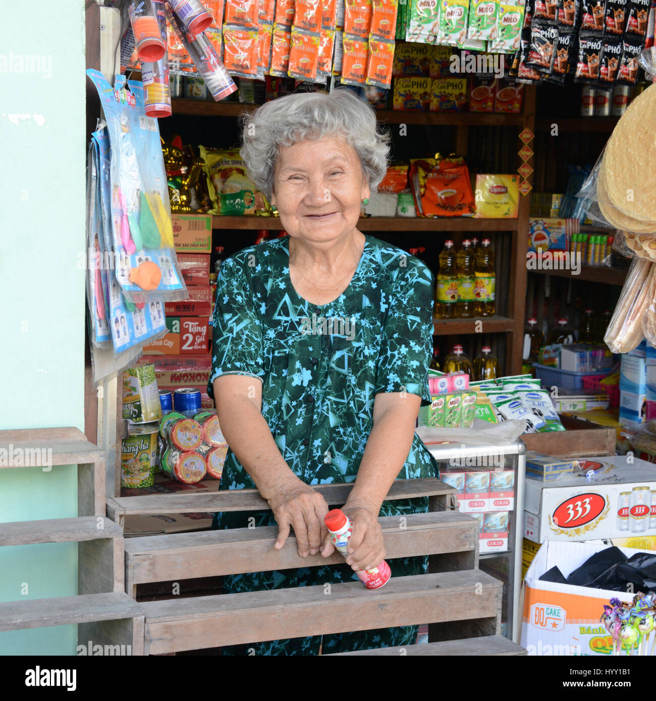 Woman shopkeeper in Cambodian village Stock Photo - Alamy