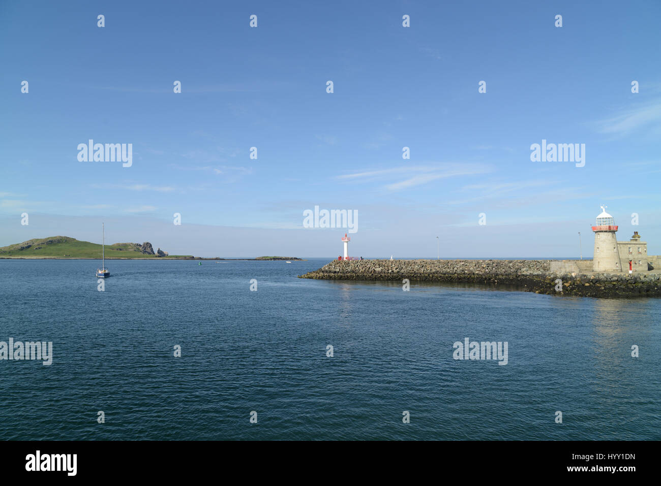 Harbour with beautiful lighthouse tower at Howth (Dublin bay, Ireland ...