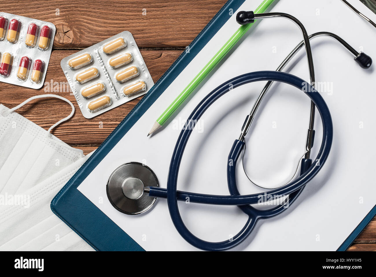 Desk of doctor with medicine things Stock Photo - Alamy