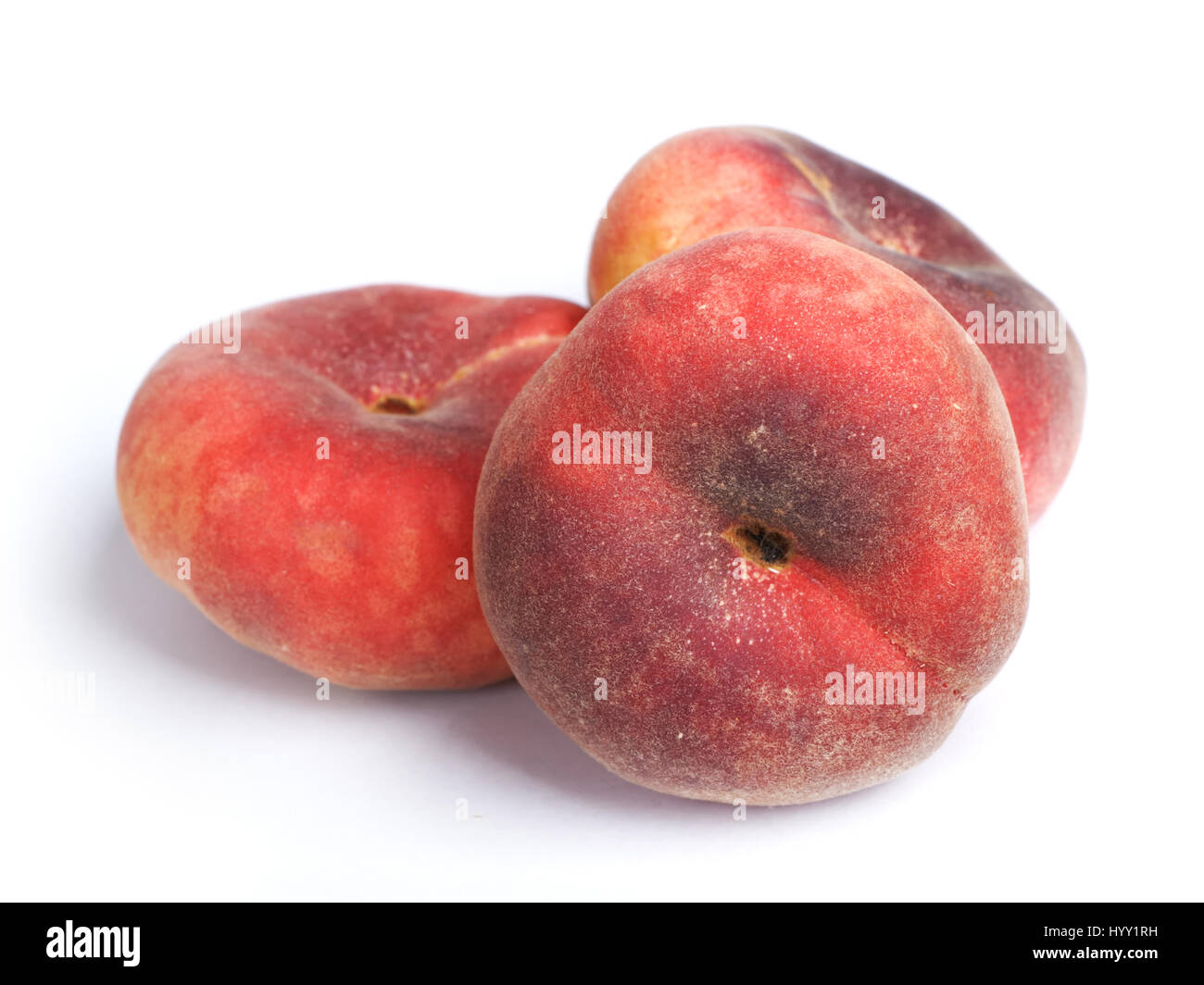 Flat nectarine isolated on white Stock Photo - Alamy