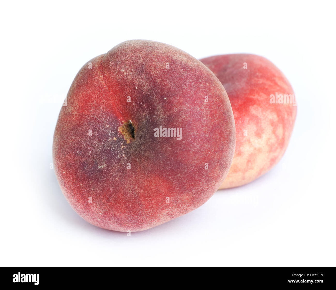 Flat nectarine isolated on white Stock Photo - Alamy